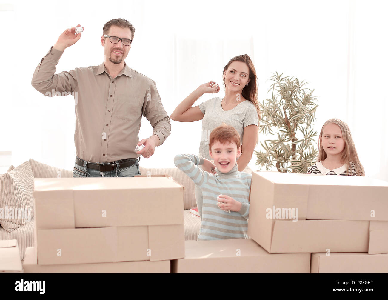 happy family standing in new apartment Stock Photo - Alamy