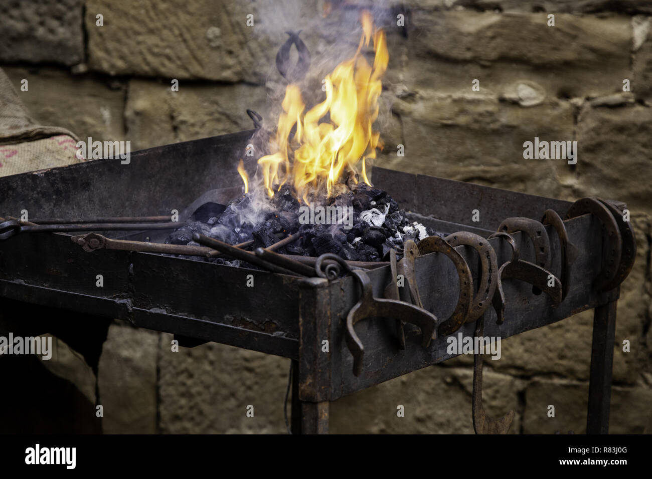 Blacksmith forging sword in workshop hi-res stock photography and ...