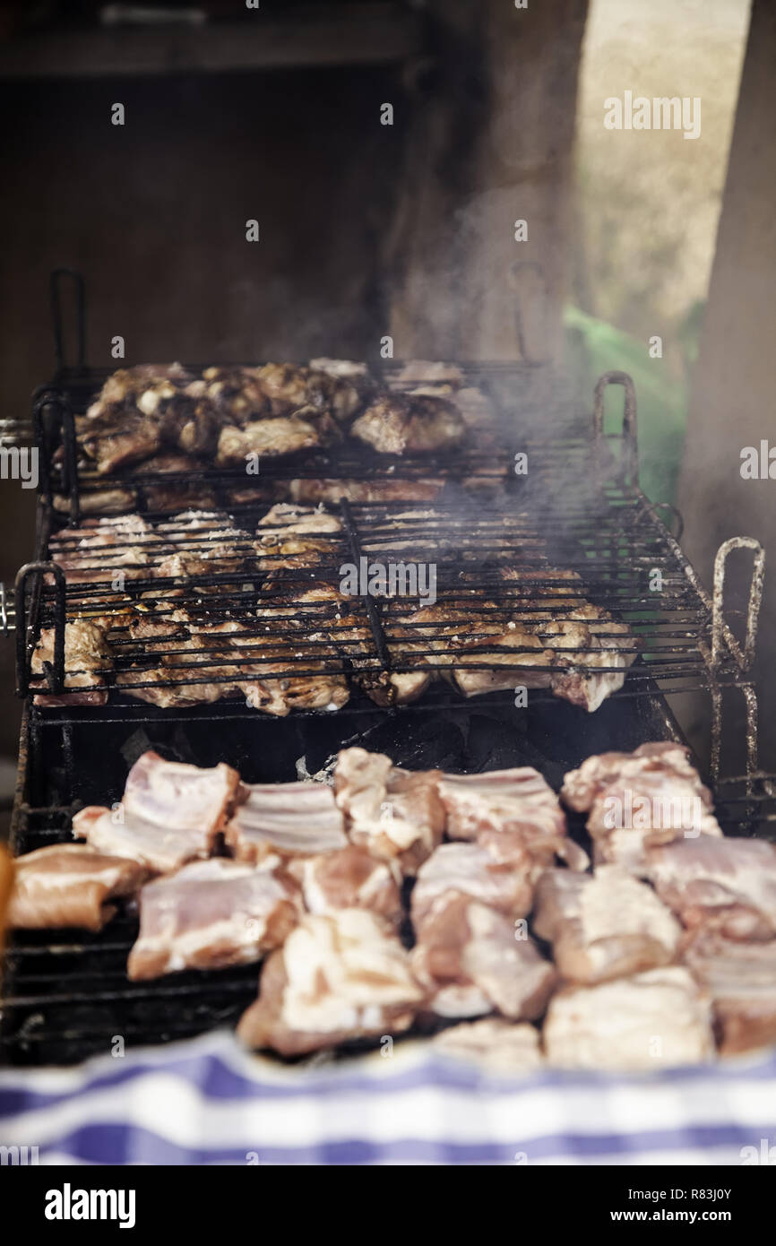 Meat on the grill, roasting meat on an ember with fire Stock Photo - Alamy