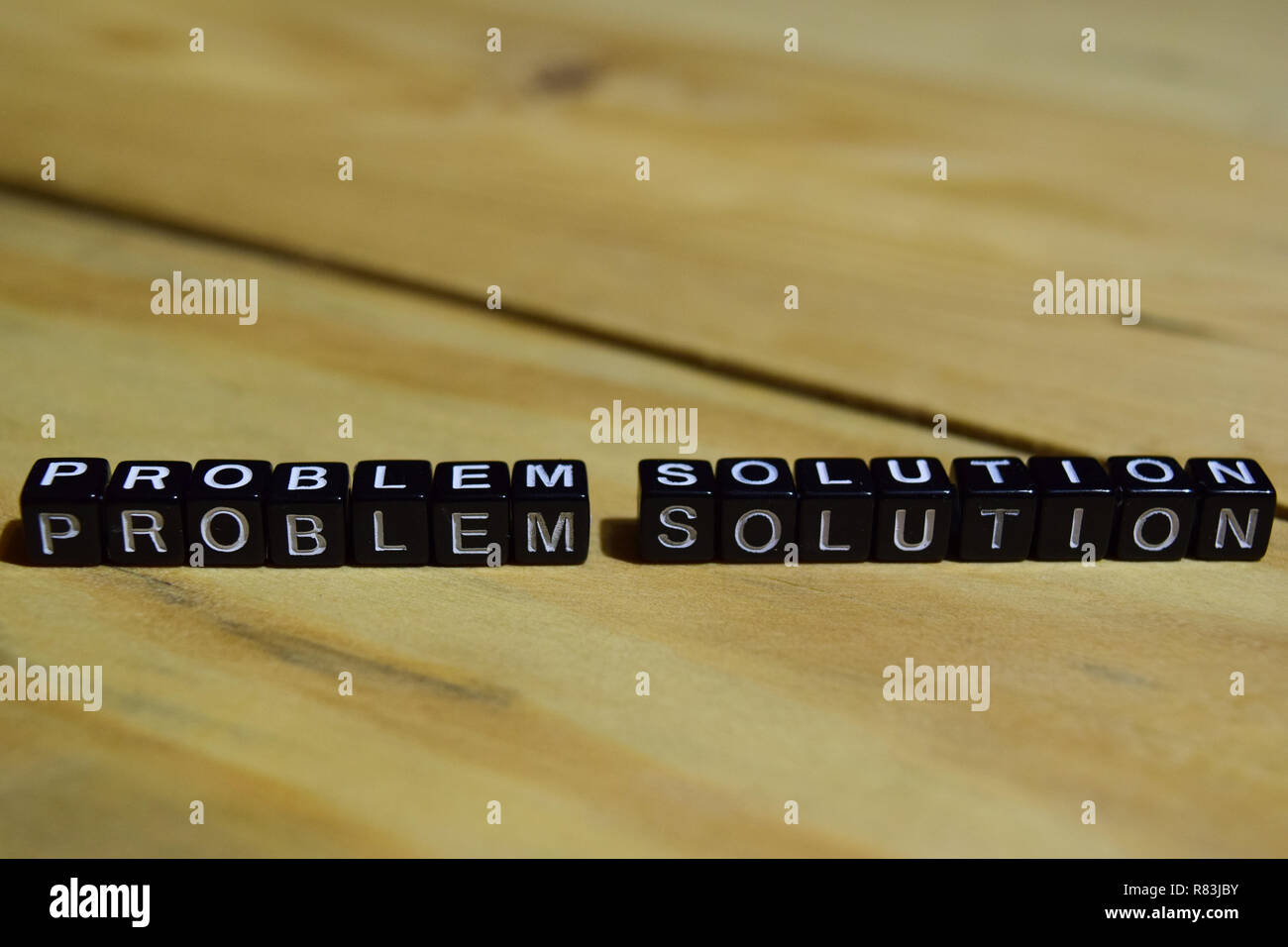 Problem Solution written on wooden blocks. education and motivation ...