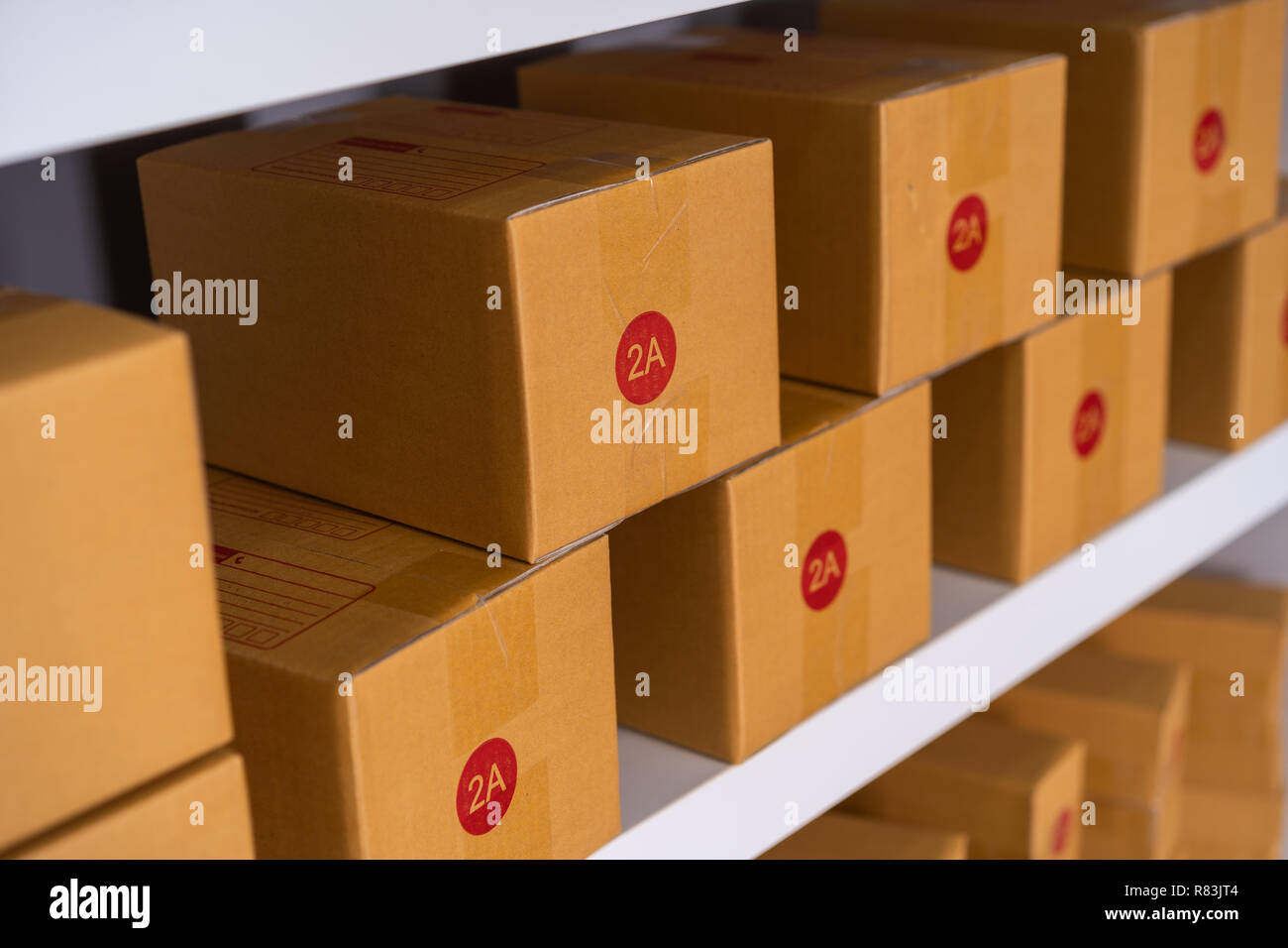Parcels on shelf ready for shipment to client in the home office Stock ...