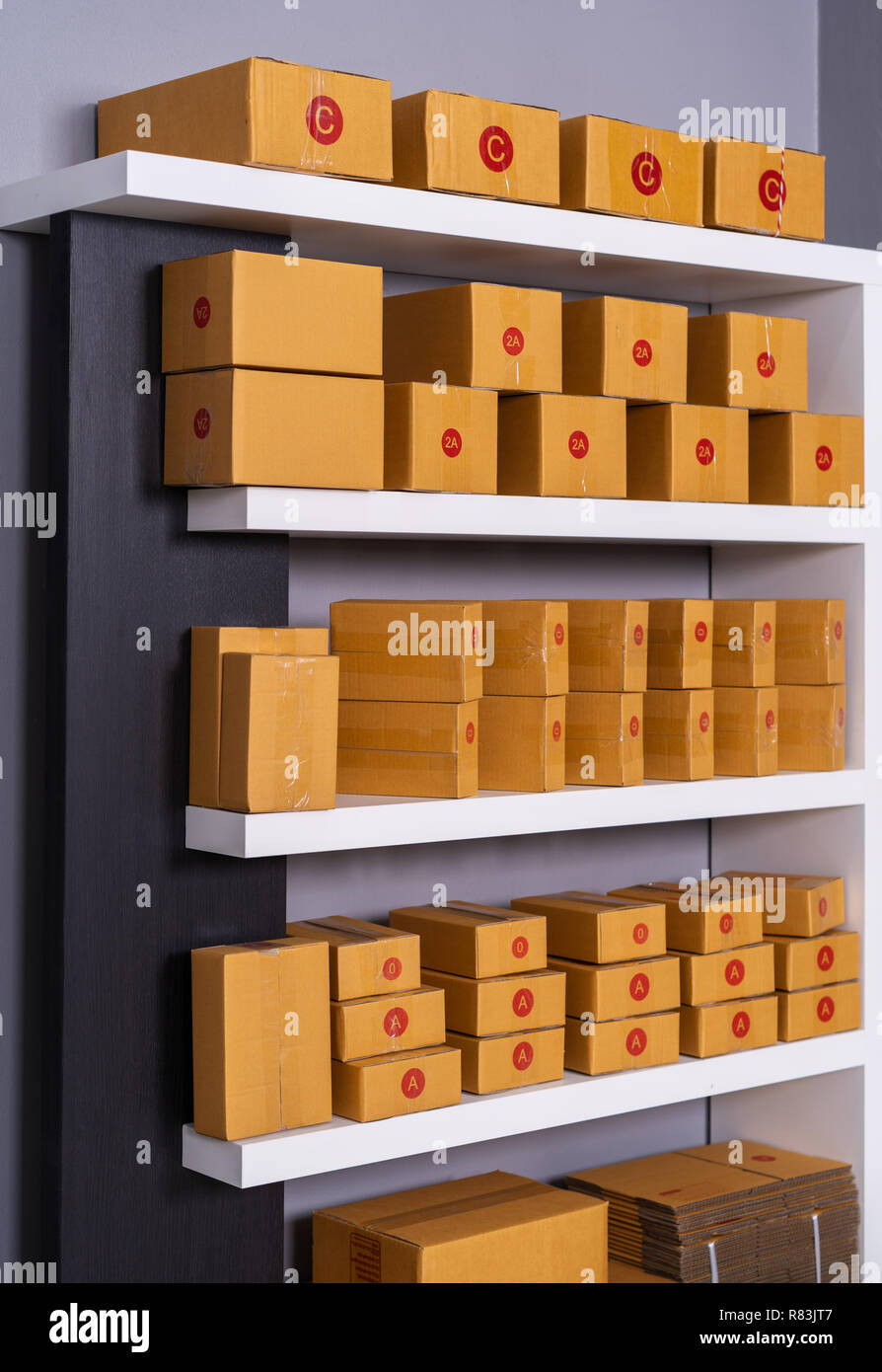 Parcels on shelf ready for shipment to client in the home office Stock ...
