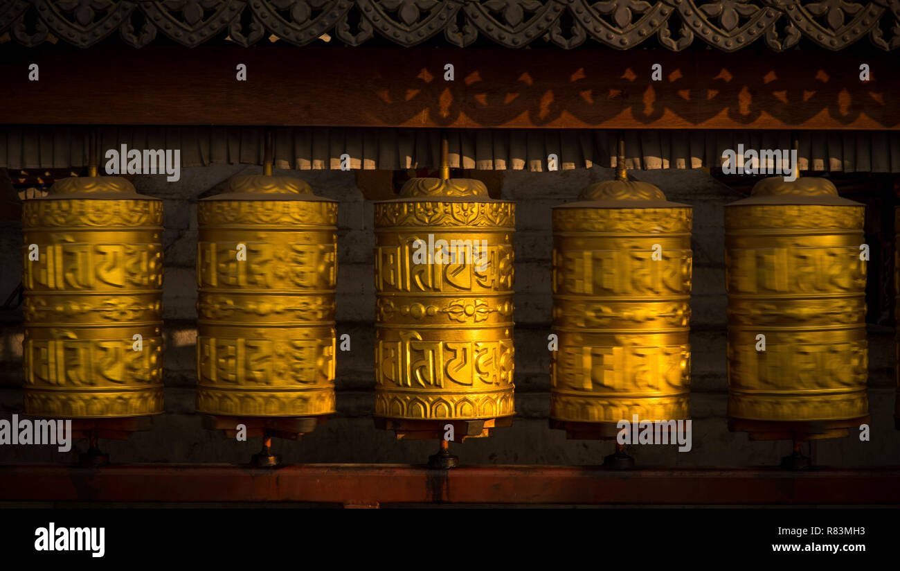 Rotating buddhist prayer wheels as symbol of buddhism religion and ...