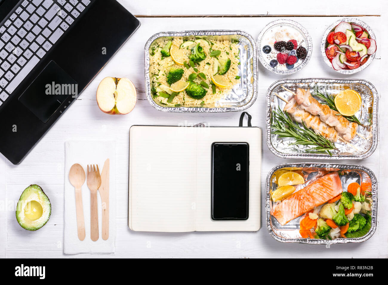 Healthy food delivery to workspace - containers, laptop, mobile phone ...