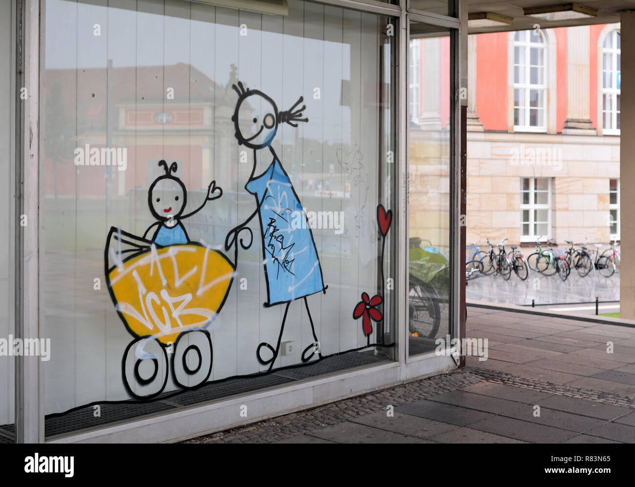 Graffiti on a shop window in Potsdam Stock Photo - Alamy
