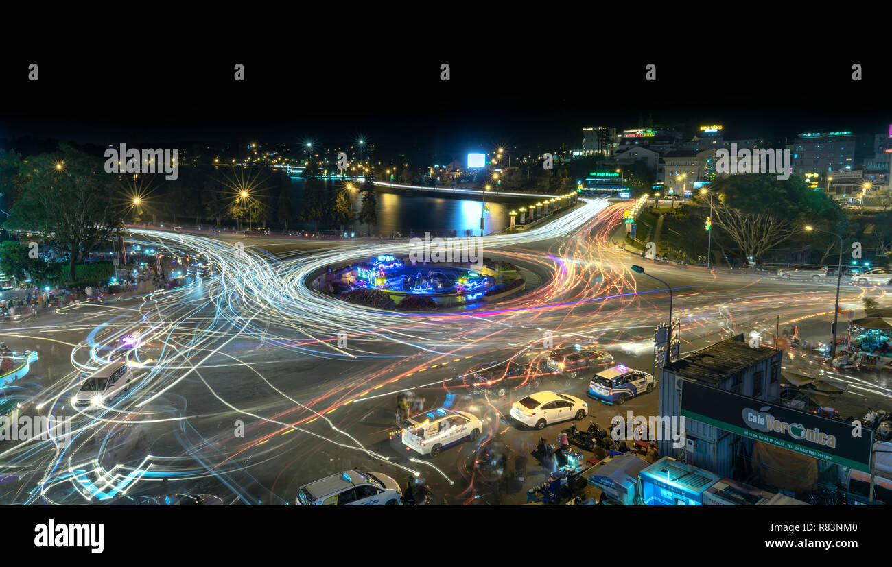 Roundabout intersections with lights night market, creating in streaks ...