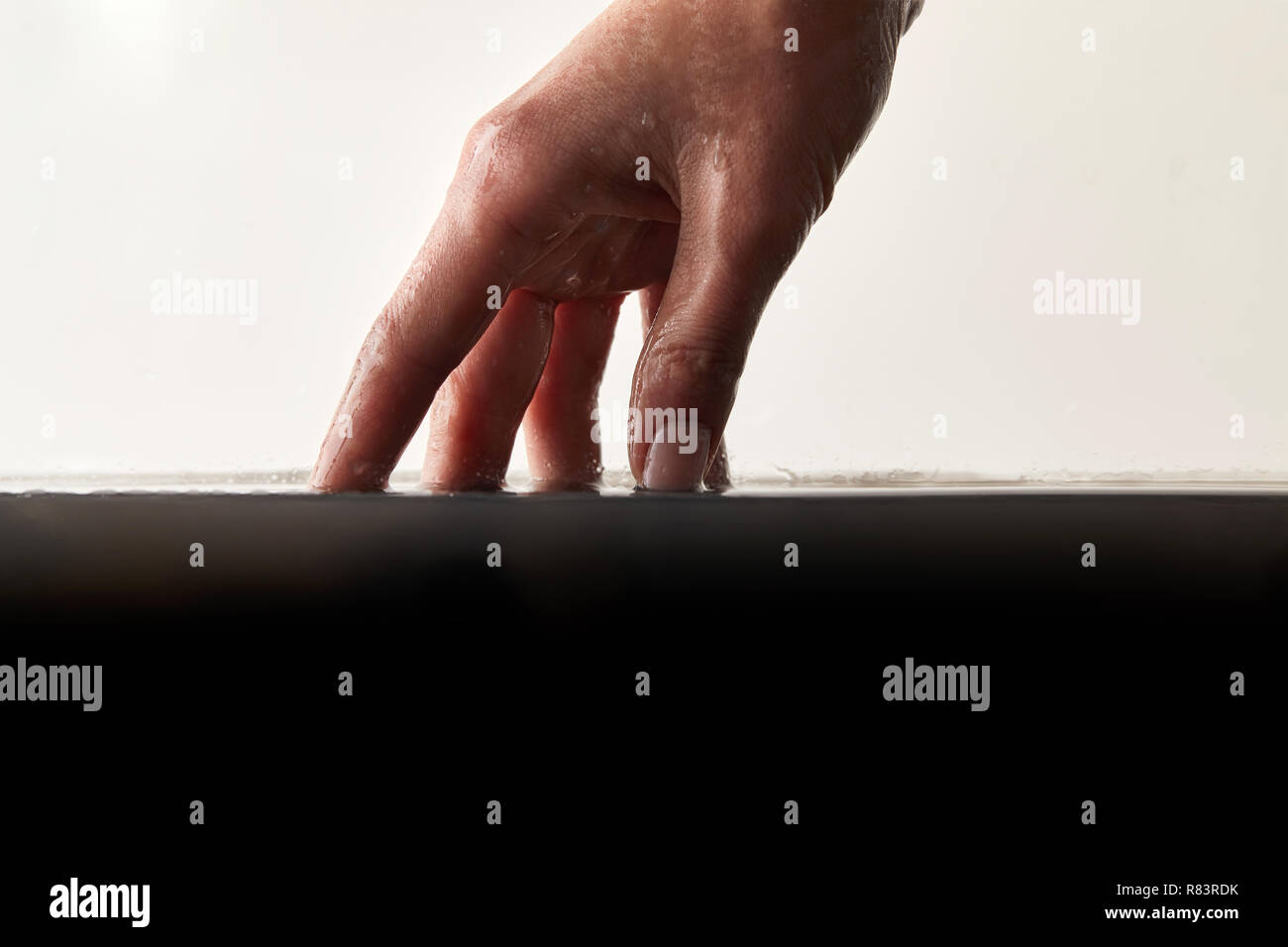 Female hand putting black hi-res stock photography and images - Alamy