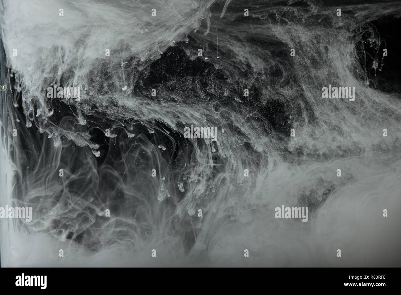 abstract flowing swirls of grey paint in water Stock Photo - Alamy