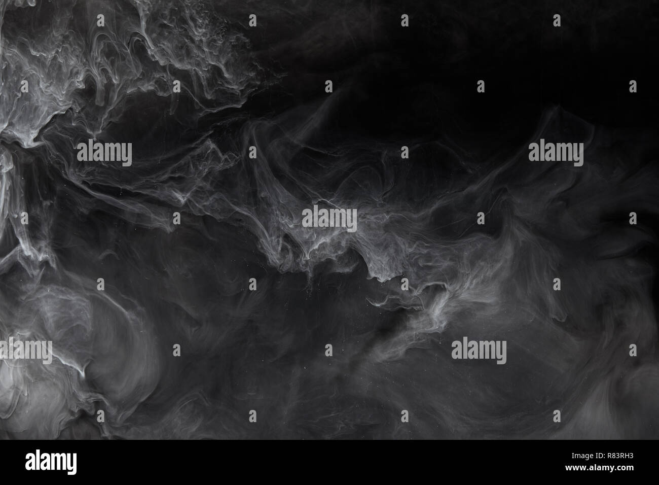 abstract splash of grey paint on black background Stock Photo - Alamy