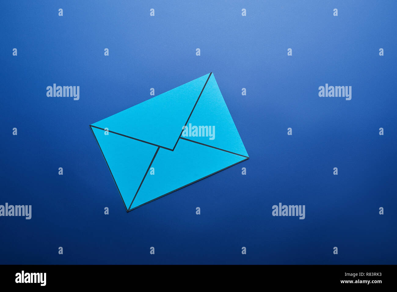 top view of light blue email sign on blue background Stock Photo - Alamy