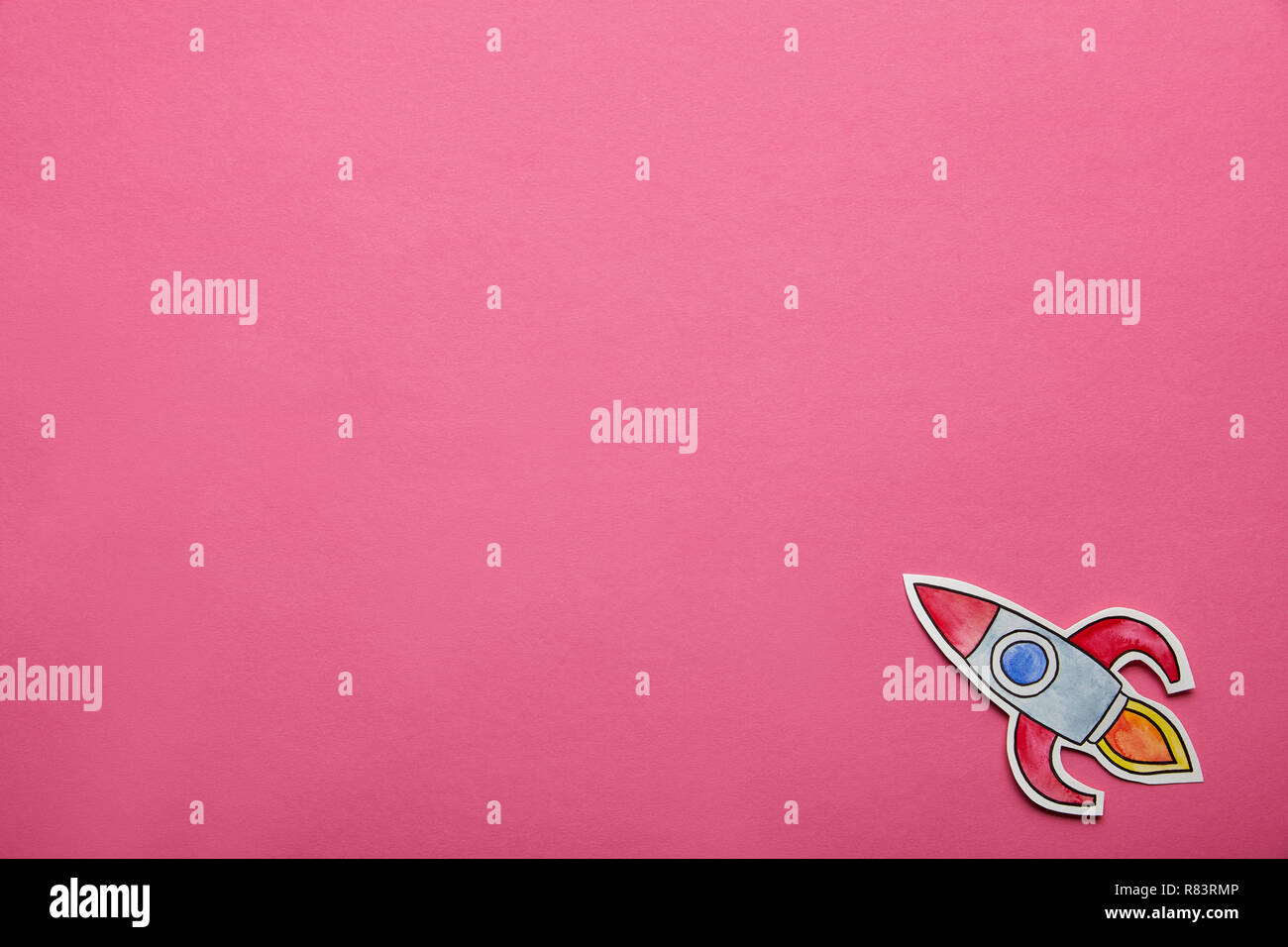top view of flying rocket on pink background Stock Photo - Alamy