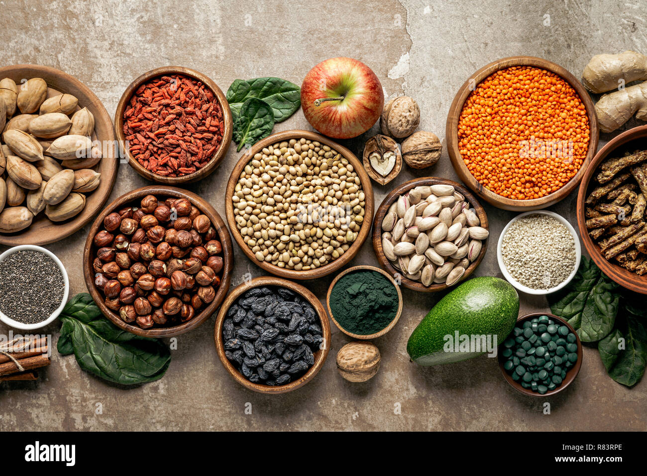 top view of superfoods, legumes and healthy ingredients on rustic ...