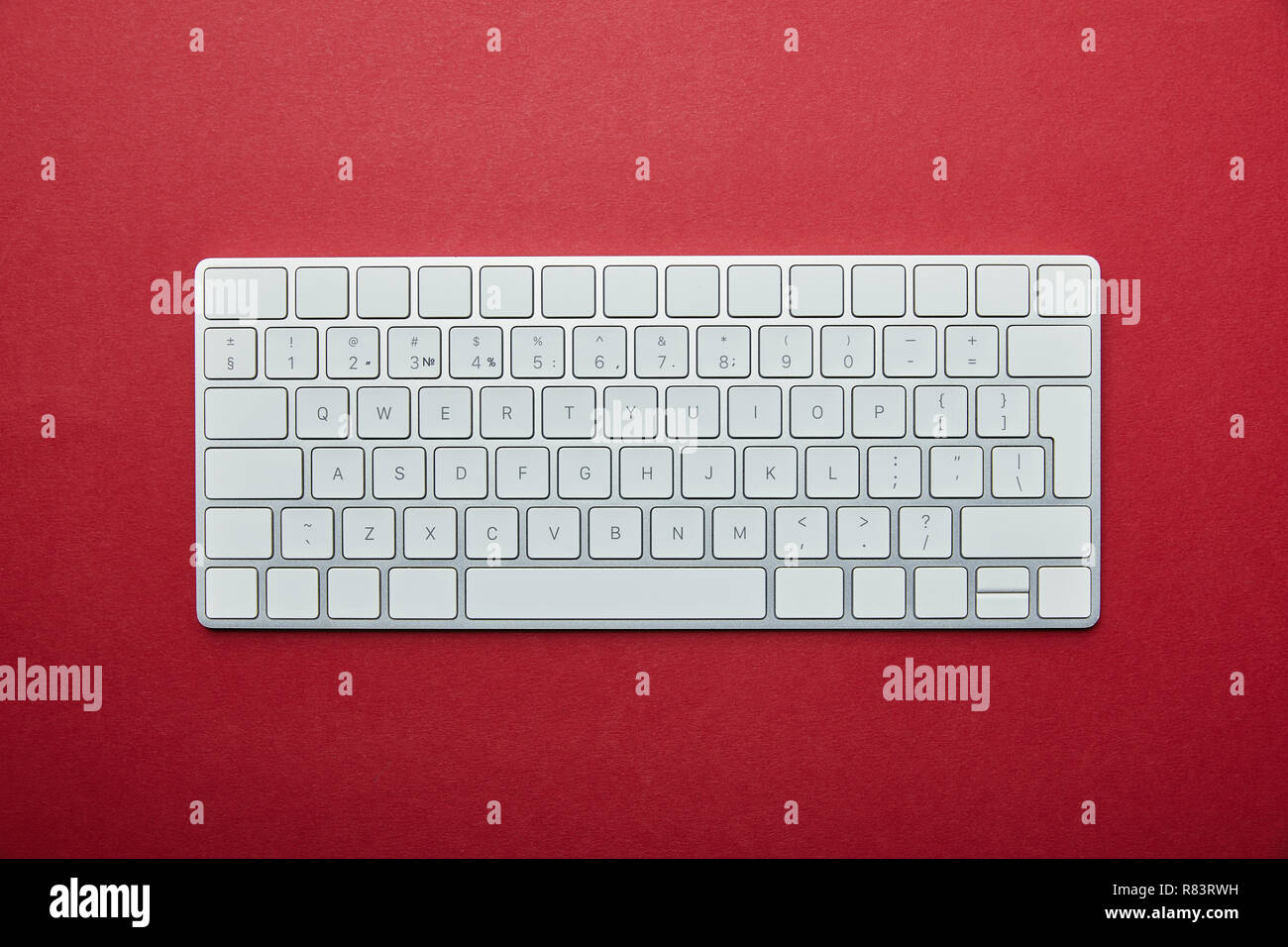 Top view of computer keyboard on red background Stock Photo - Alamy