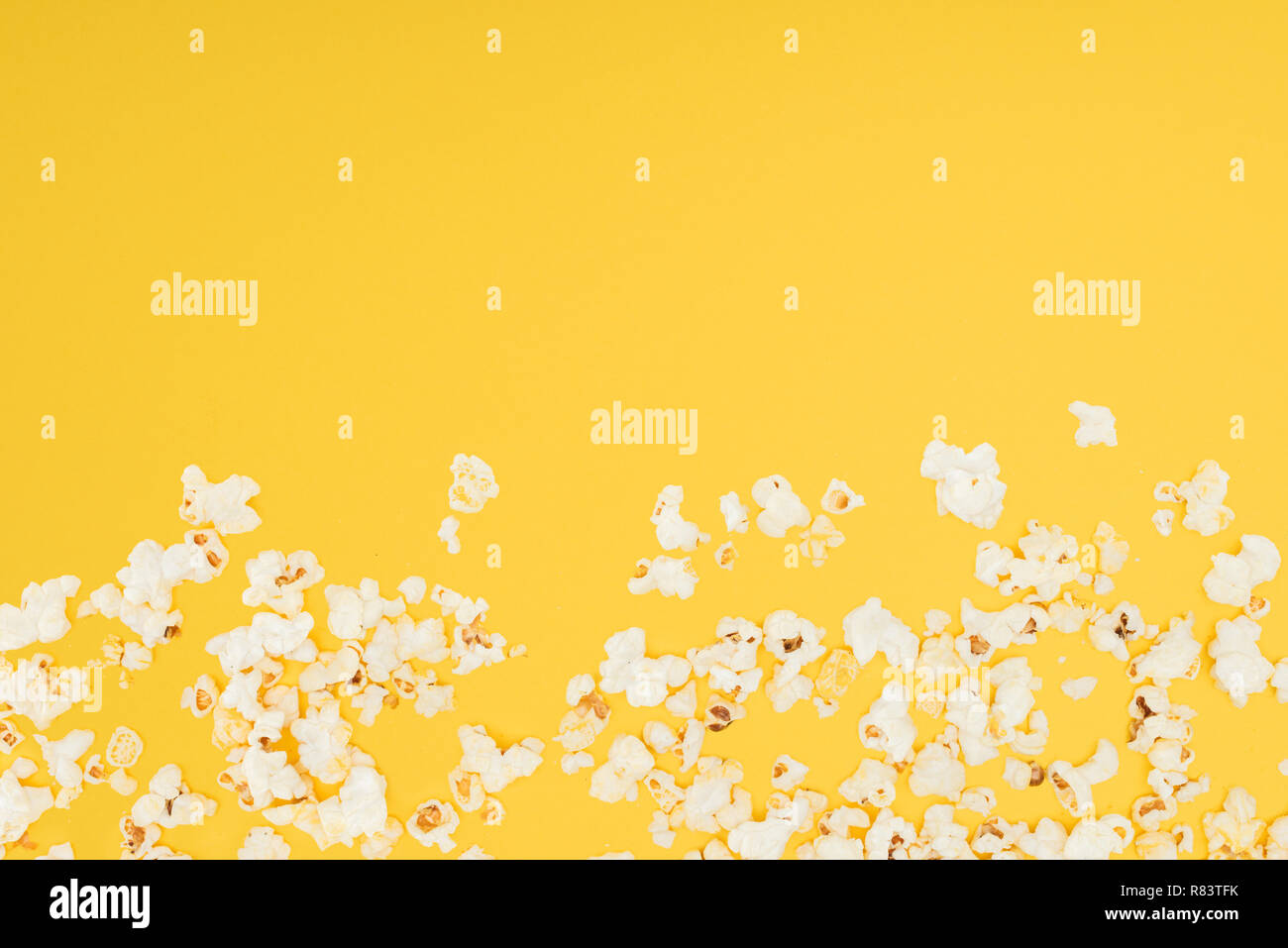 bottom border of fresh tasty popcorn isolated on yellow Stock Photo - Alamy