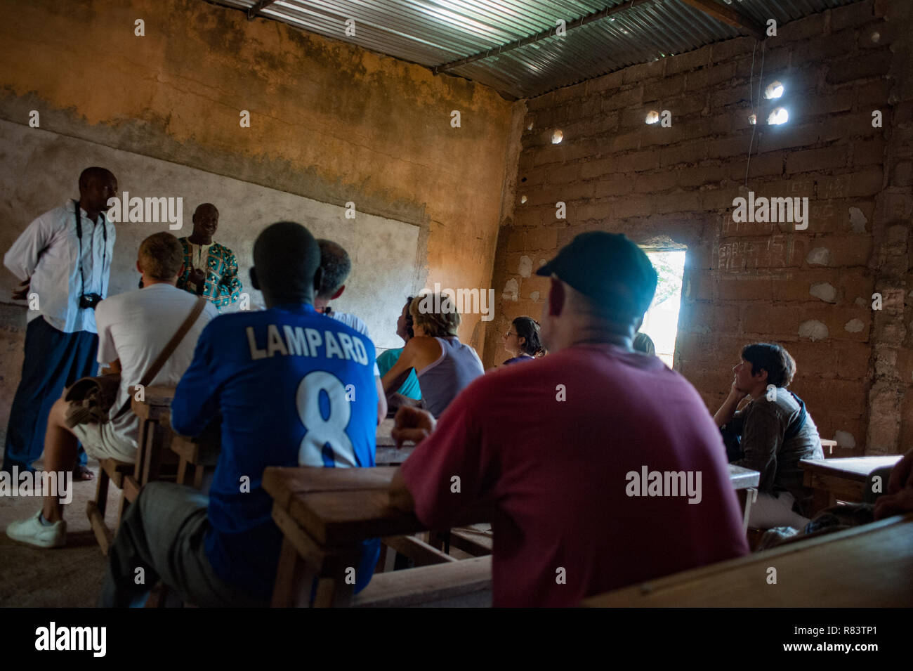Mali, Africa. White caucasian volunteers and black african people enjoy ...