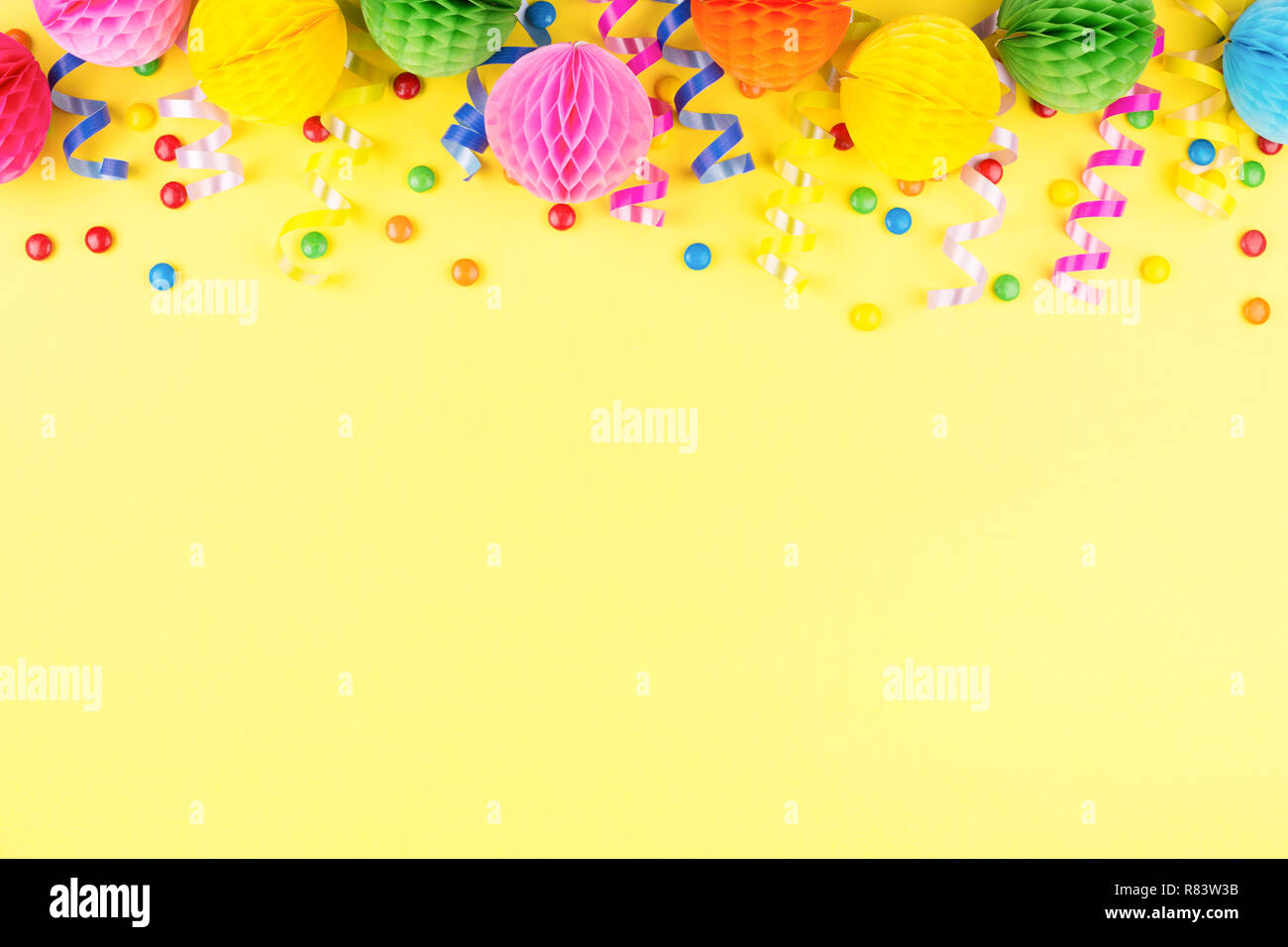Birthday party background on yellow. Top view. Border made of colorful ...