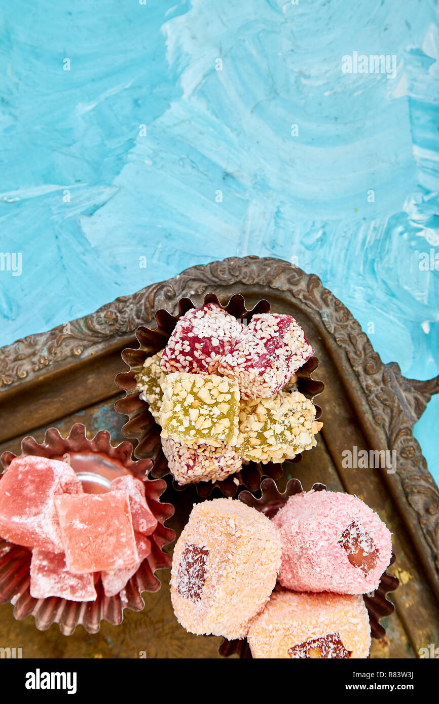 Set of various Turkish delight in a copper plate on metal tray blue ...