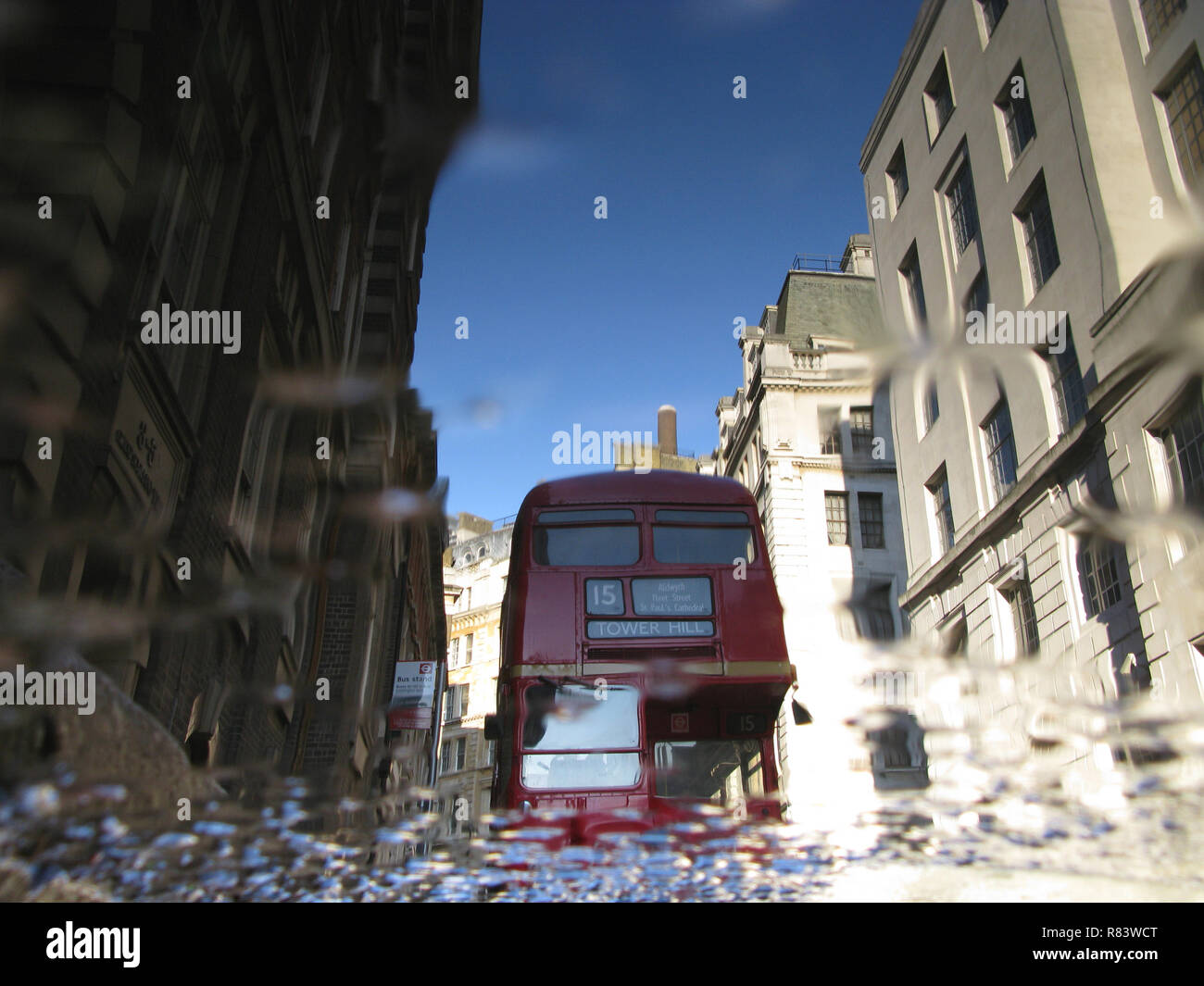 Old double decker reflecting on water hi-res stock photography and ...