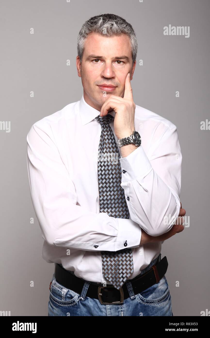 Portrait of a beautiful Caucasian man in front of a white background ...