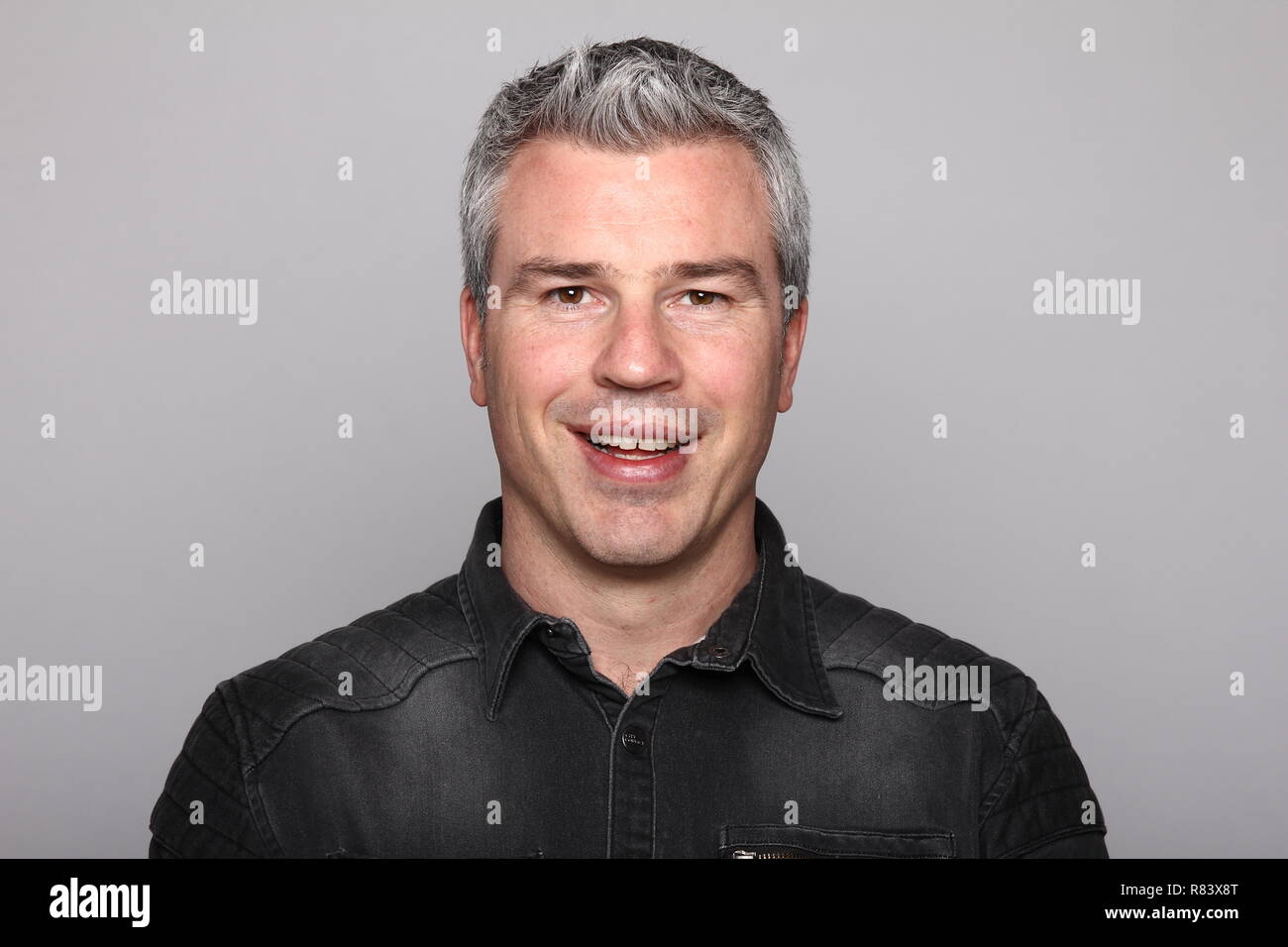 Portrait of a beautiful Caucasian man in front of a white background ...