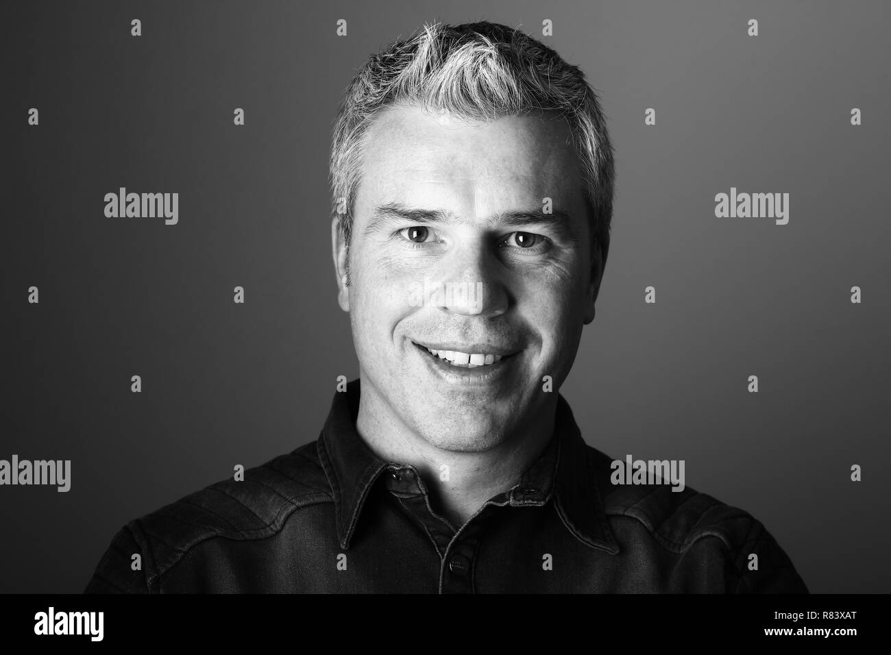 Portrait of a beautiful Caucasian man in front of a white background ...