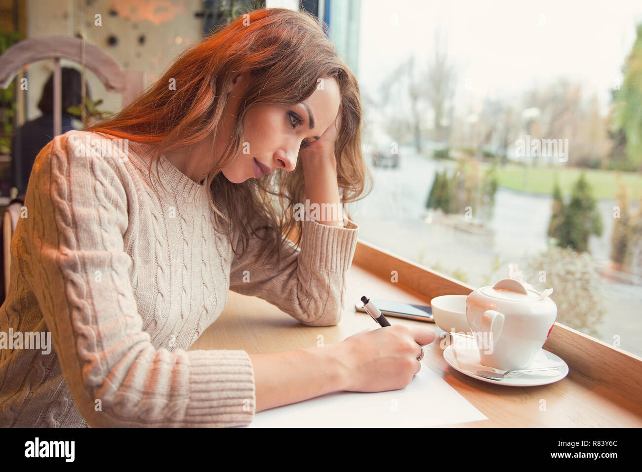 Woman writing letter hi-res stock photography and images - Alamy