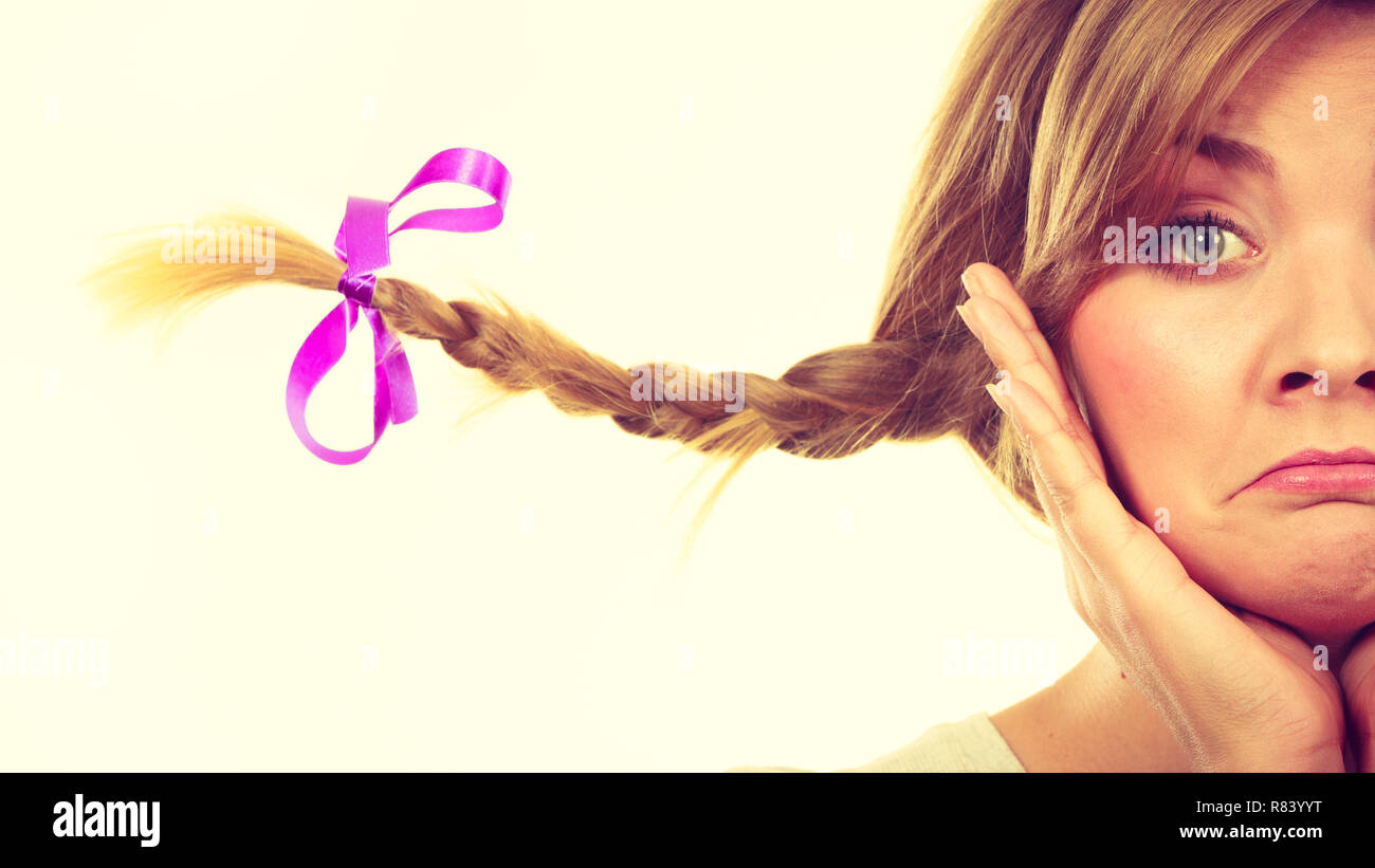 Emotions expressions, sadness concept. Teenage girl in blonde braid ...