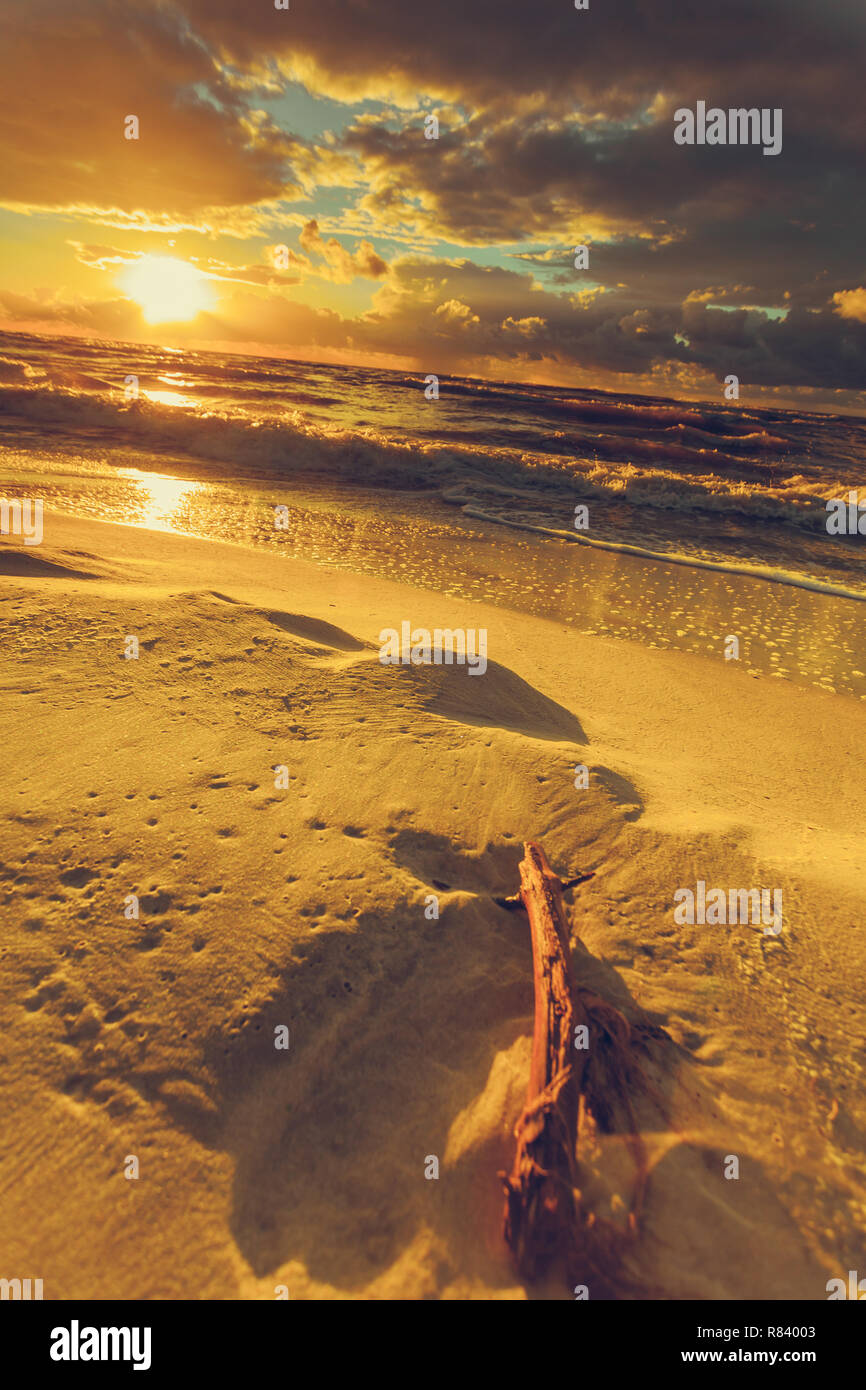 Amazing colorful sunset over evening sea horizon, clouds sky and sandy ...
