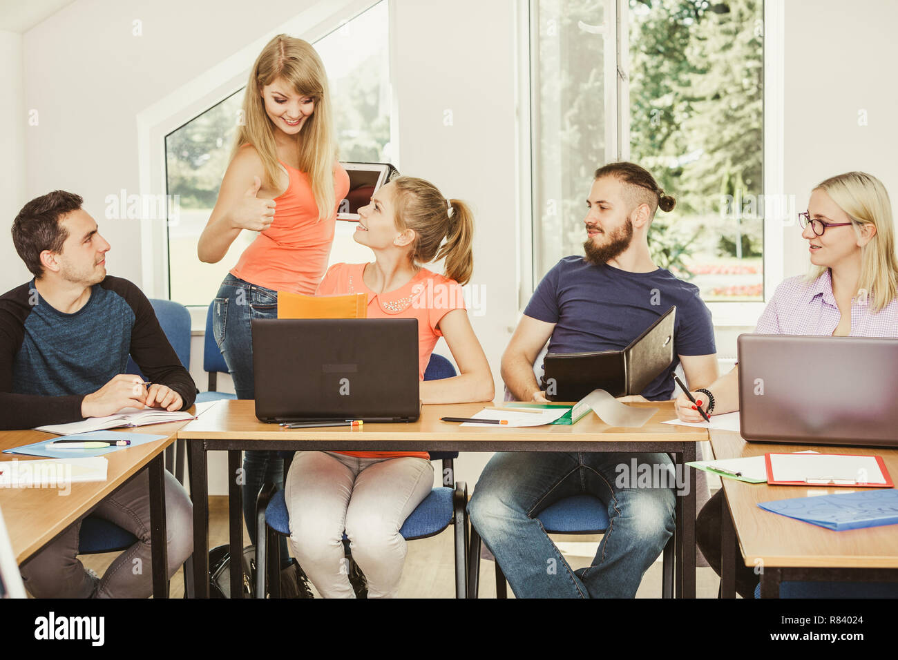 Teaching helping technology concept. Woman young teacher or tutor with ...