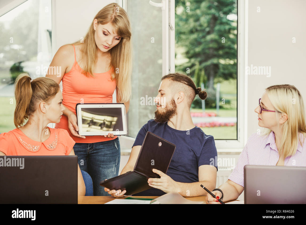 Teaching helping technology concept. Woman young teacher or tutor with ...