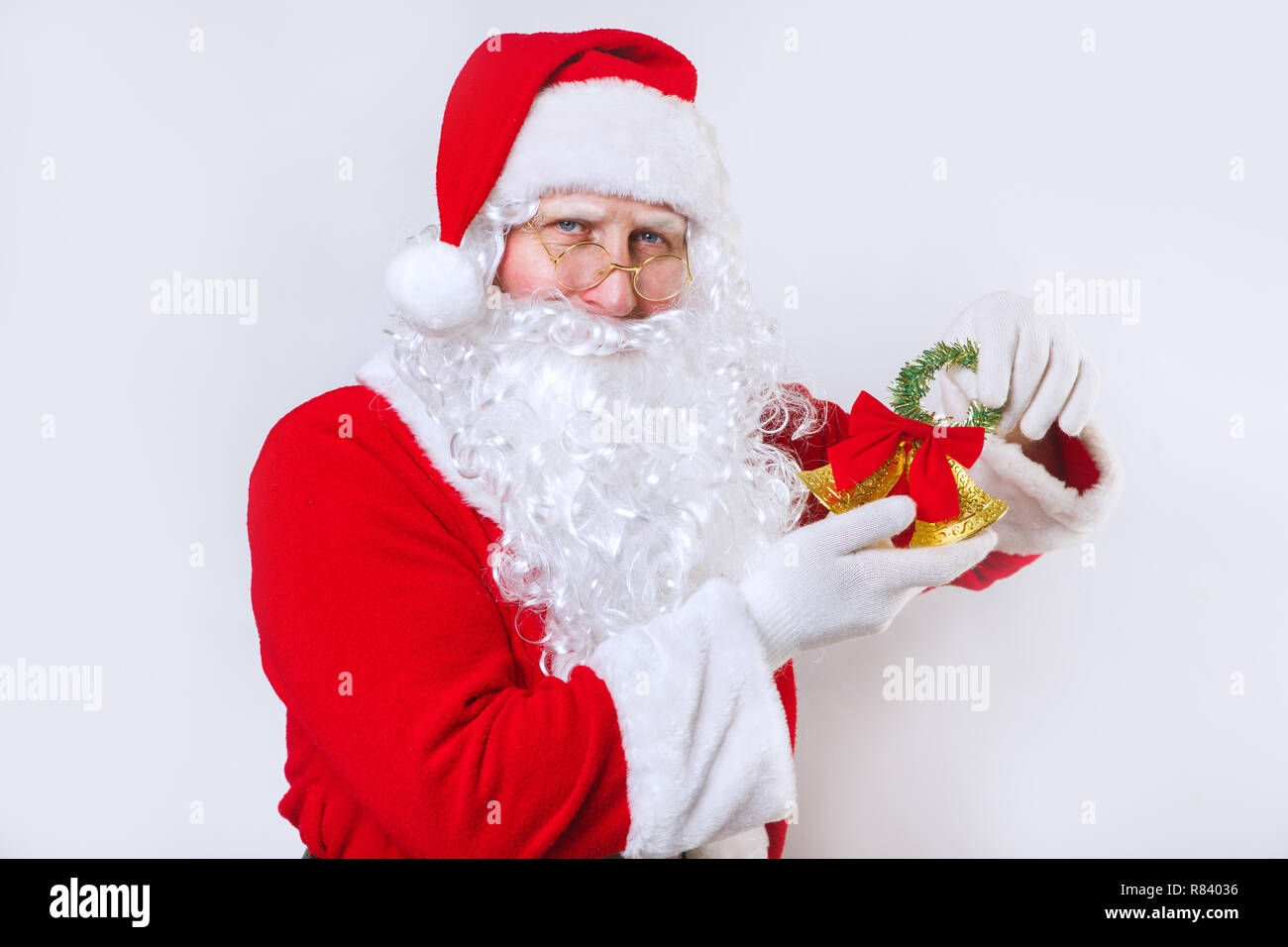 Santa Claus ringing a bell on a white background . Christmas time Stock ...