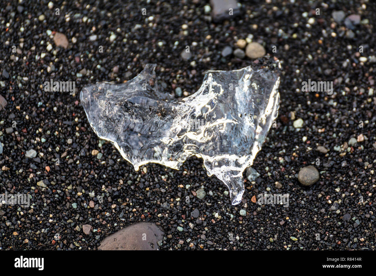 Crystal clear ice on black lava at diamond beach in iceland Stock Photo ...