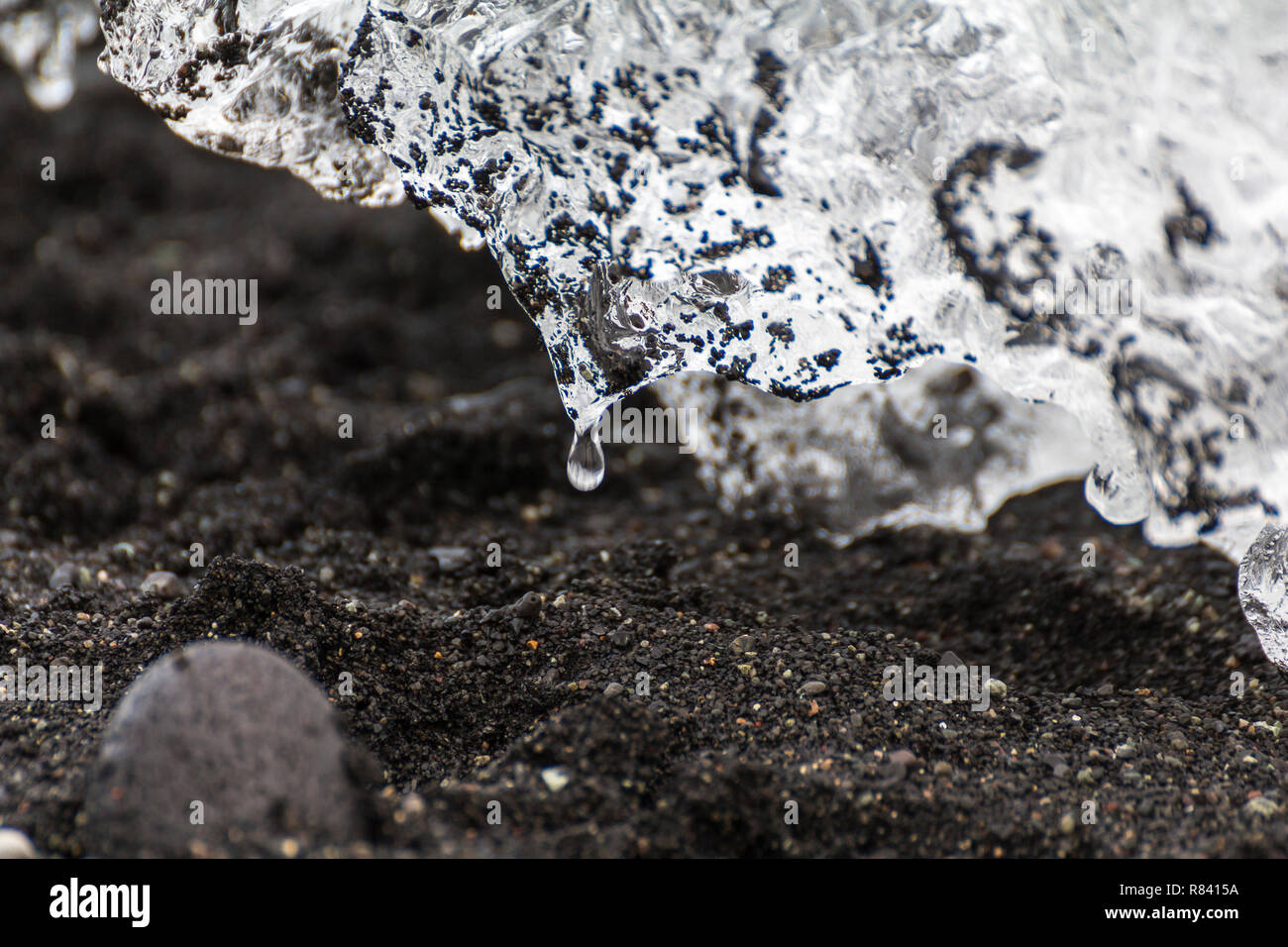 Crystal clear ice on black lava at diamond beach in iceland Stock Photo ...