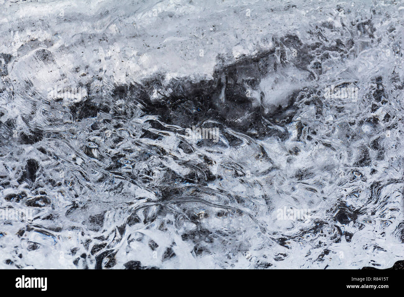 Crystal clear ice on black lava at diamond beach in iceland Stock Photo ...