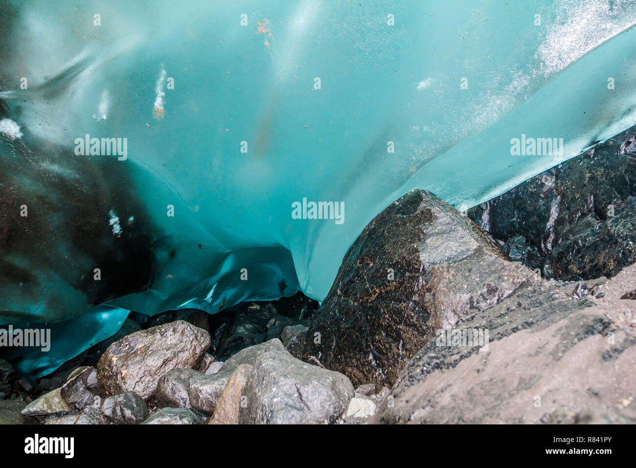 Inside small glacier cave in Iceland Stock Photo - Alamy