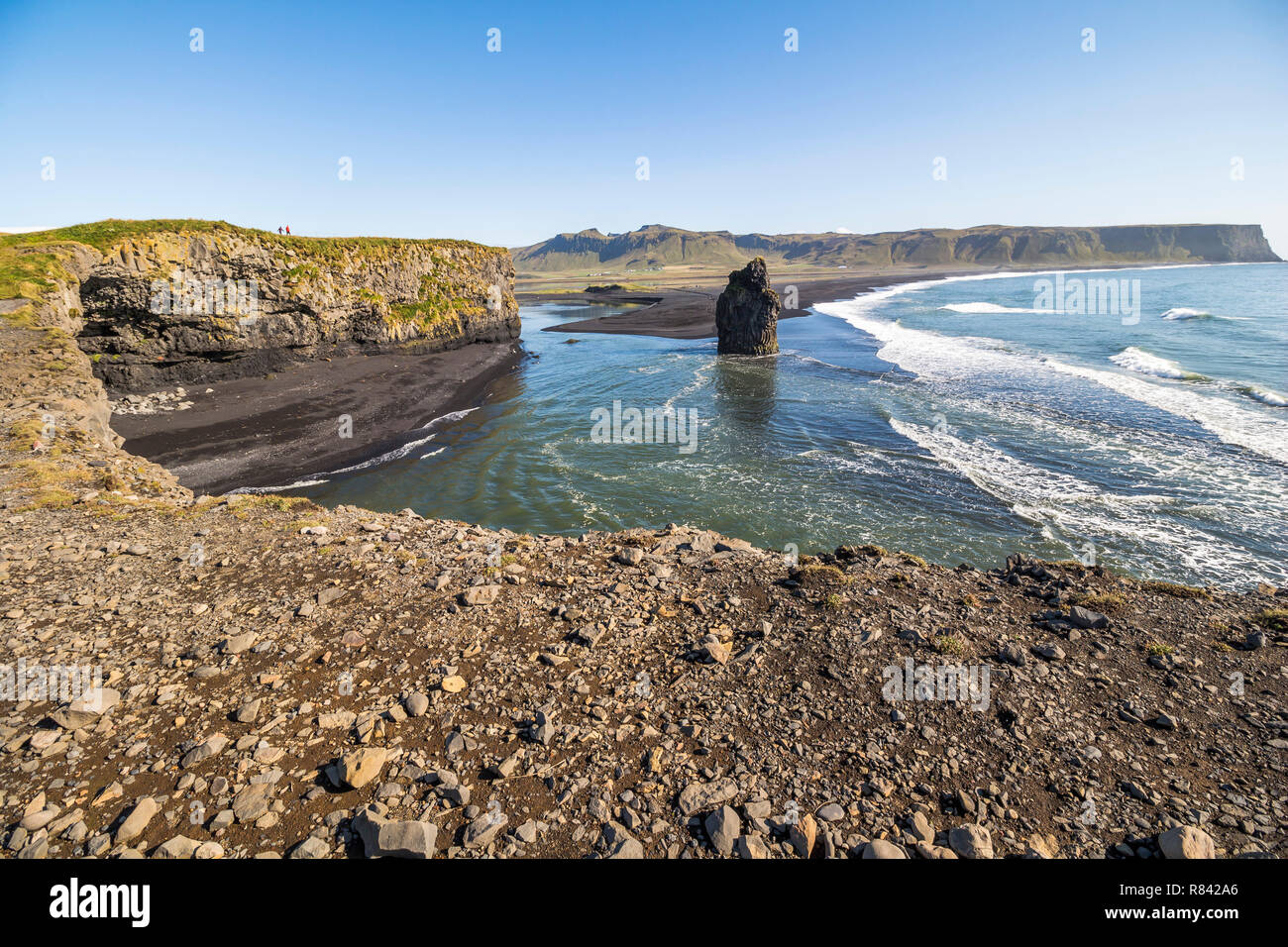 Stone in water on Kirkjufjara beach Iceland Stock Photo - Alamy
