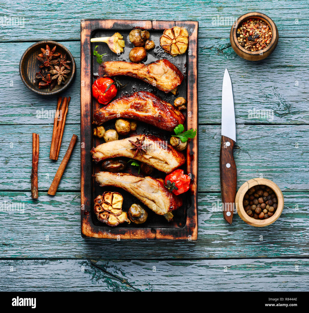 Grilled ribs on an old vintage wooden cutting board.Summer BBQ Stock ...