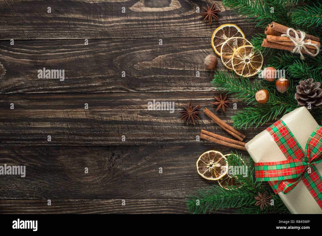 Christmas food background with spices and nuts on dark wooden ta Stock ...
