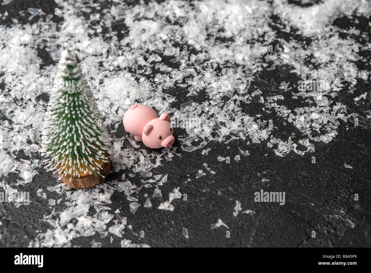 Image of piggy, artificial Christmas tree, snow Stock Photo - Alamy