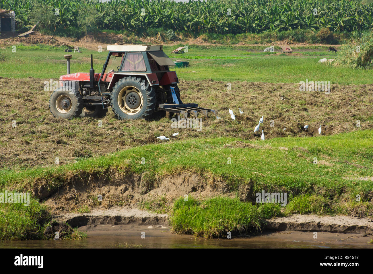 Tractor ploughing rural agricultural arable fields in african ...