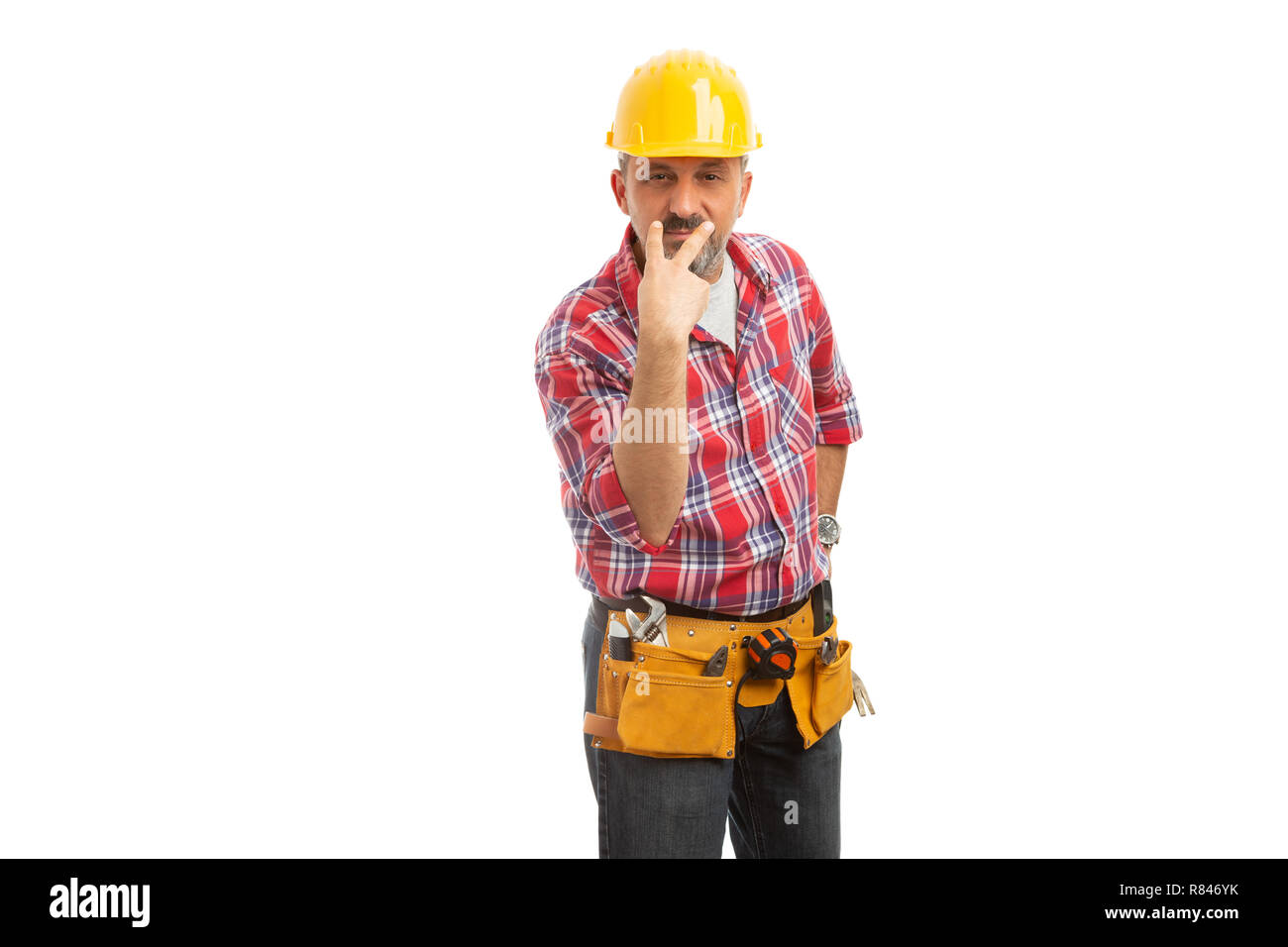 Mad builder making look at me sign with fingers isolated on white ...