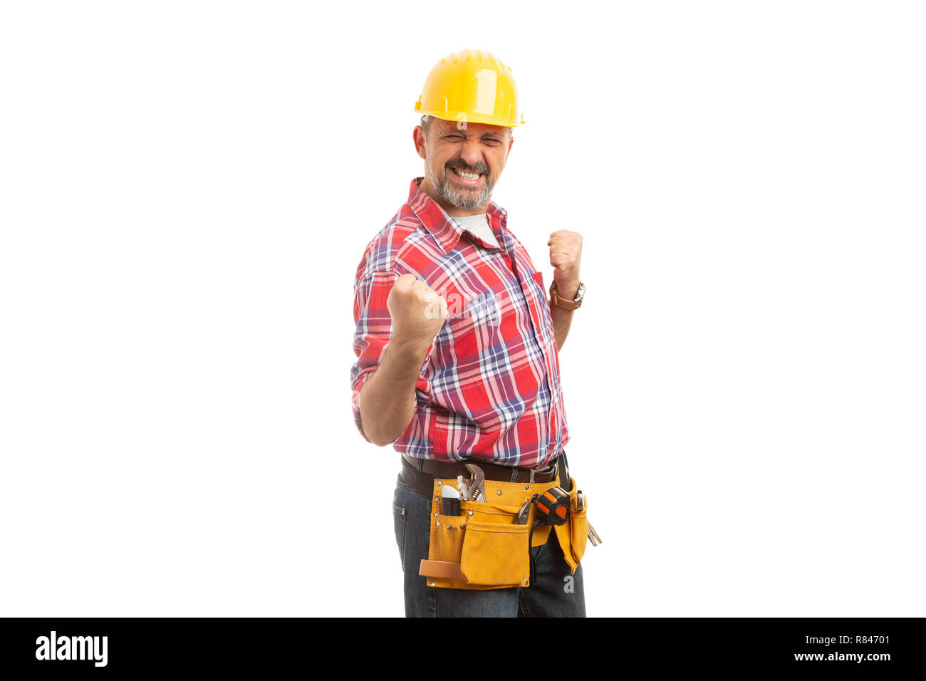 Happy builder making success celebration gesture with fists and ...