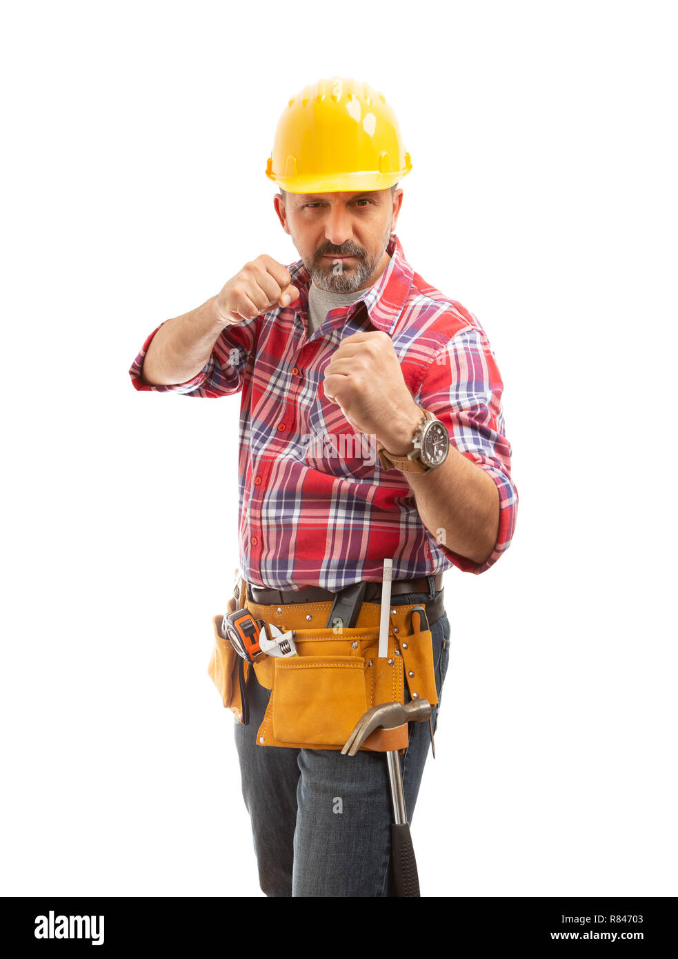 Mad builder preparing fists up for fight as aggressive concept isolated ...