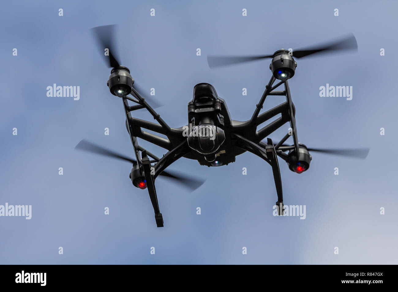 modern quadcopter drone with camera flying overhead closeup Stock Photo ...