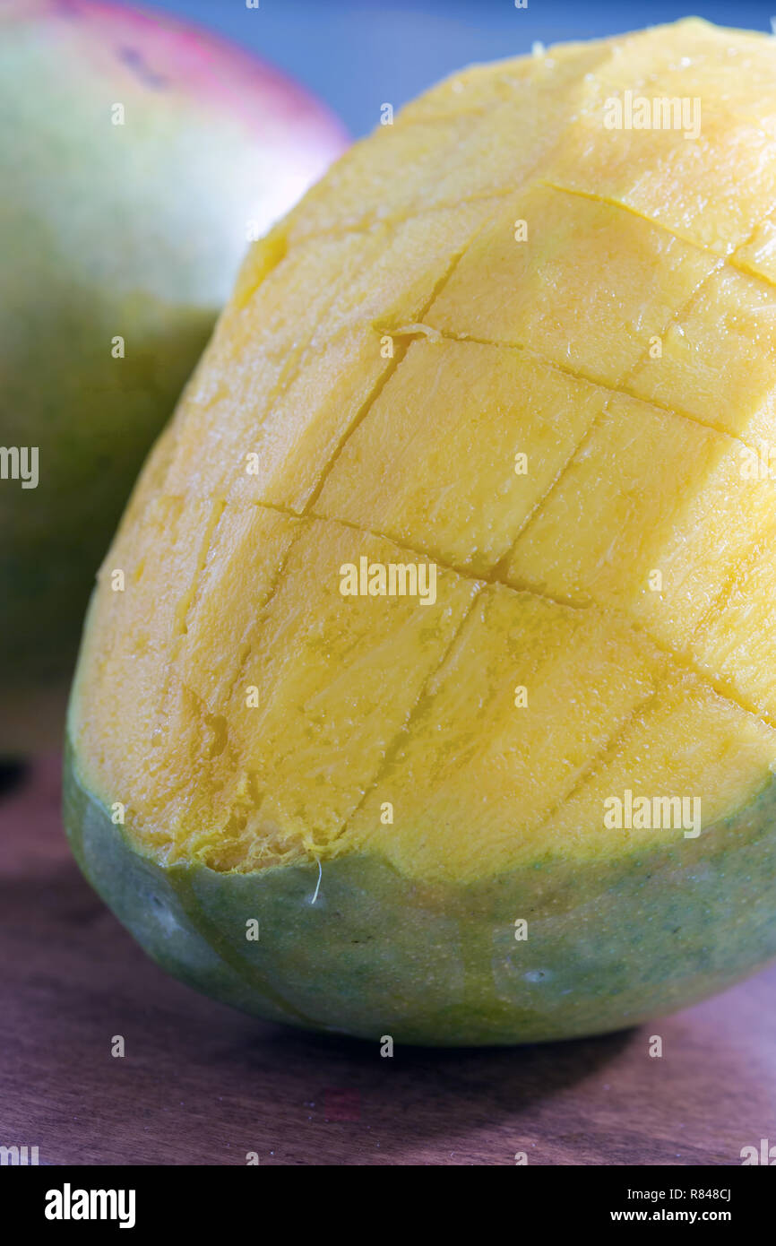 Half of a mango with the flesh cut into cubes Stock Photo - Alamy