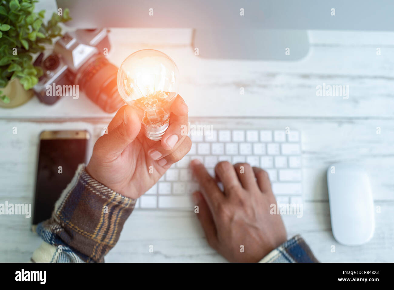 Mobile bulbs with innovative ideas and creativity Stock Photo - Alamy