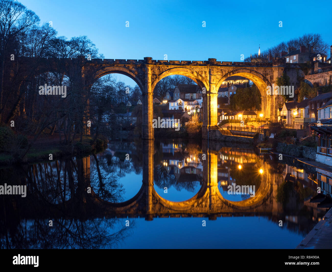 Railway viaduct over the River Nidd floodlit at dusk Knaresborough ...