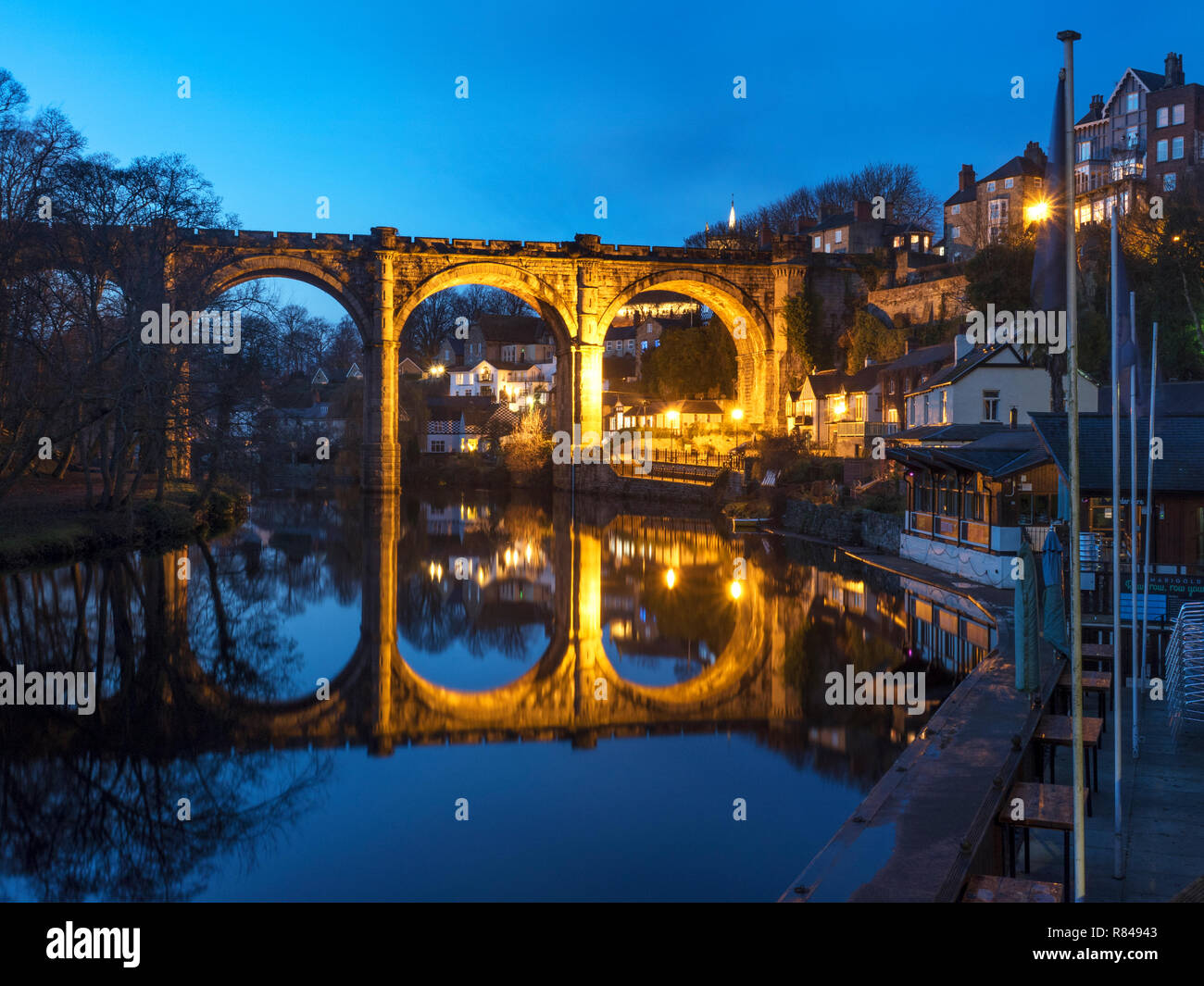 Railway viaduct over the River Nidd floodlit at dusk Knaresborough ...