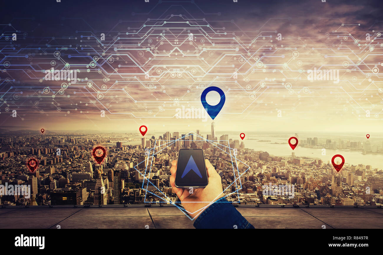 Man on the rooftop holding a mobile phone, blue gps arrow follow the ...