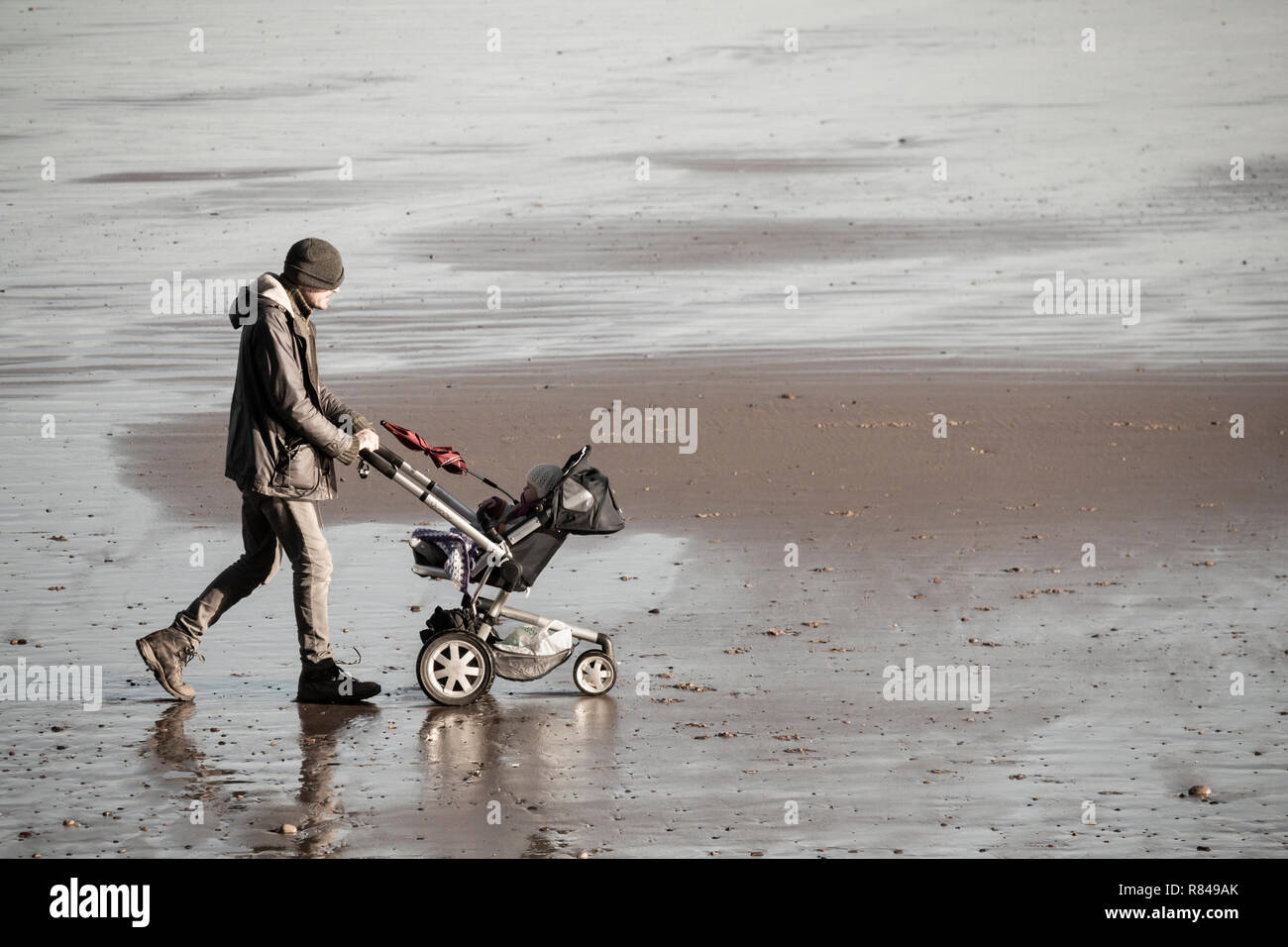 Father pushing stroller hi-res stock photography and images - Alamy